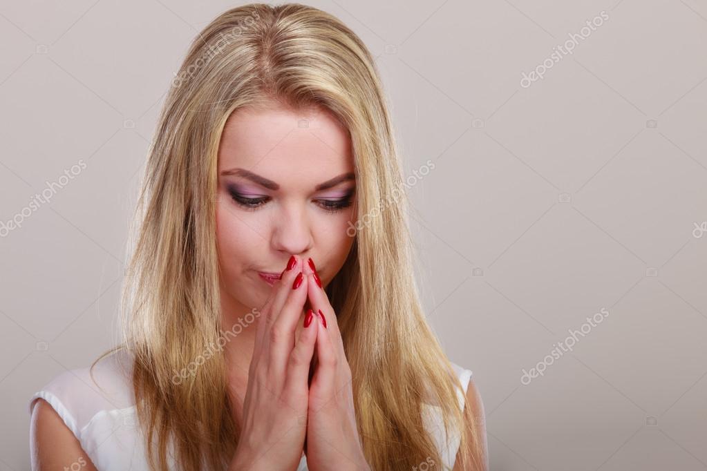 Sad girl praying Stock Photo by ©Voyagerix 73065681