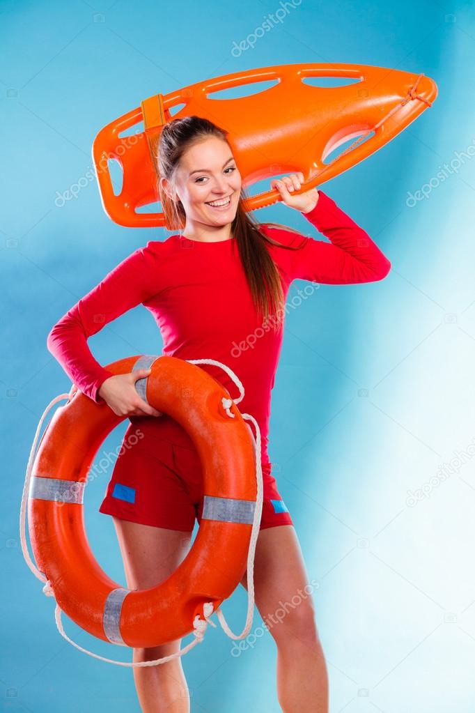 Girl lifeguard with rescue equipment — Stock Photo © Voyagerix #75363267