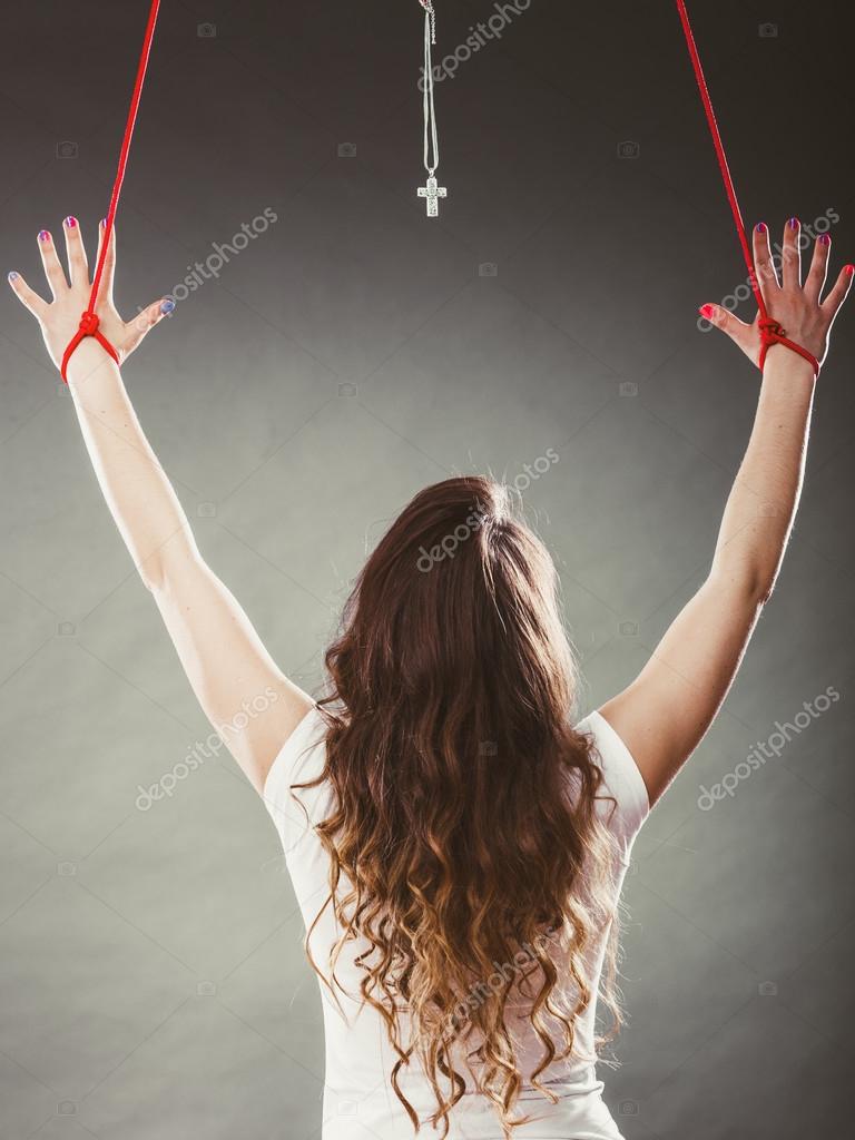 Tied woman forced to worship. — Stock Photo © Voyagerix #76408909