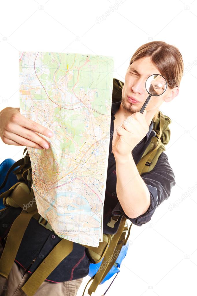 Man tourist reading map Stock Photo by ©Voyagerix 80501088