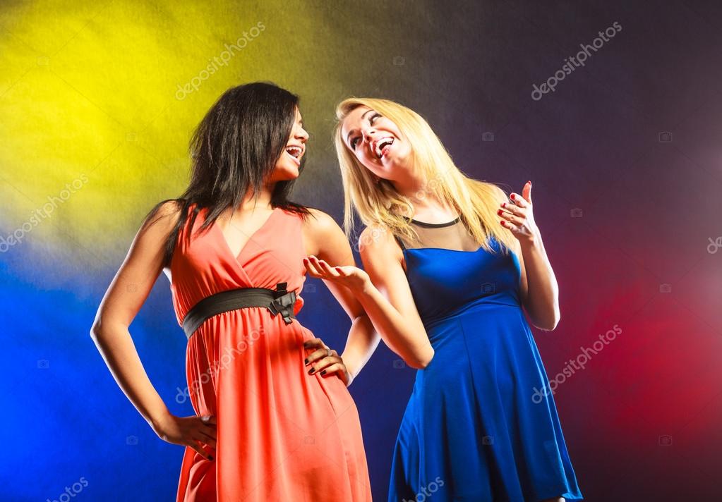 Two funny women in dresses. Stock Photo by ©Voyagerix 80732376