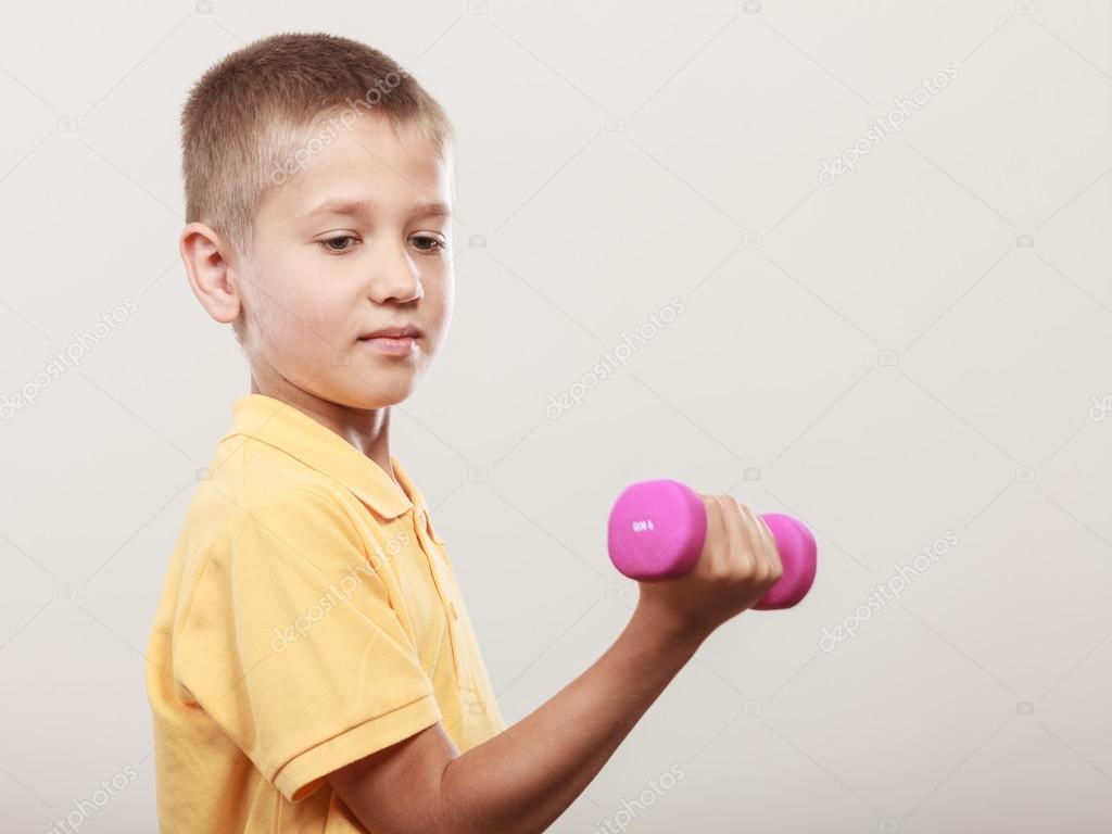 Sports boy making exercise with dumbbell. — Stock Photo © Voyagerix ...