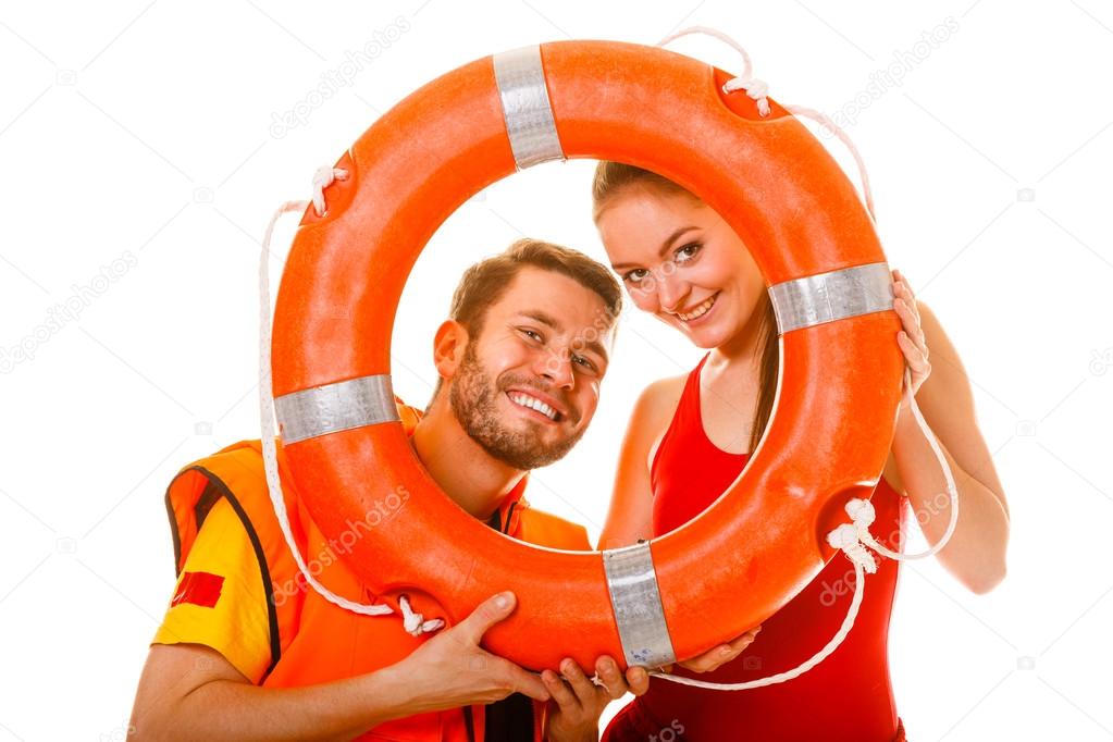 Lifeguards in life vest with ring buoy having fun. Stock Photo by ...