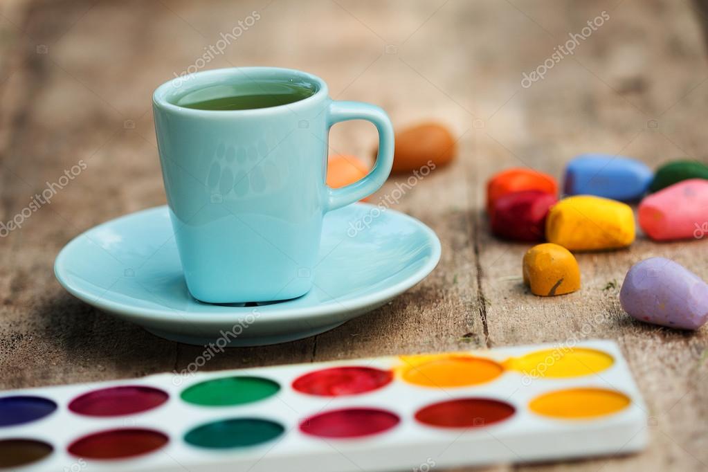 Back to school. Cup of tea with watercolor and crayons. — Stock Photo ...