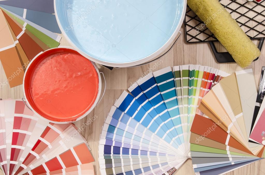 Blue and red paint cans and samples with different color shades with ...