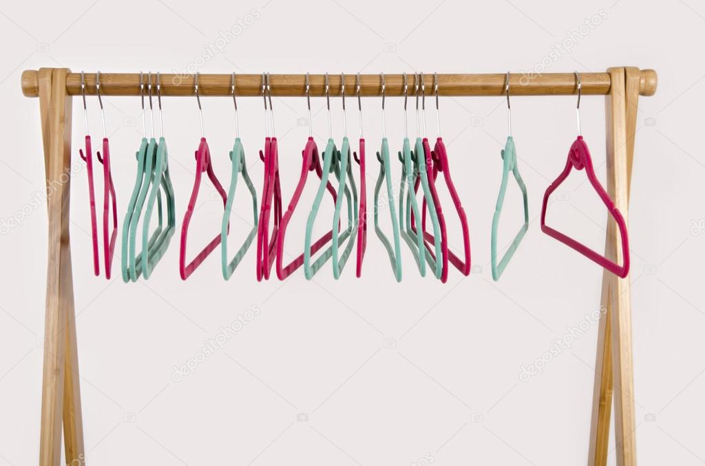 Rack of clothes with empty hangers. Stock Photo by ©luanateutzi 92396020
