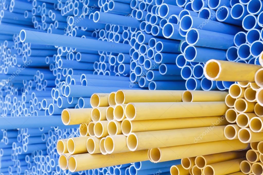 PVC pipes for electric conduit (yellow) and water (blue) — Stock Photo ...