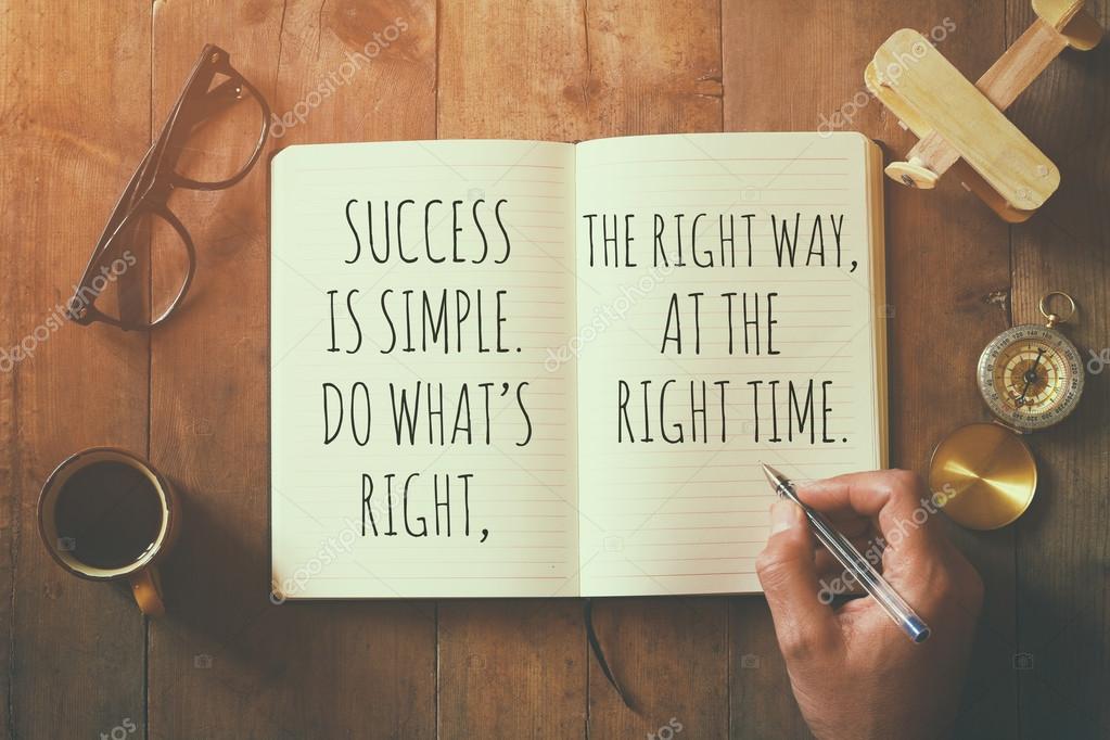 Open notebook over wooden table with motivational saying — Stock Photo ...