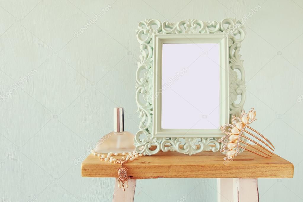 Blank victorian style frame, perfume bottle and necklace Stock Photo by ...