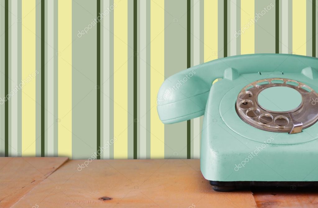 Retro pastel mint telephone on wooden table and abstract retro ...