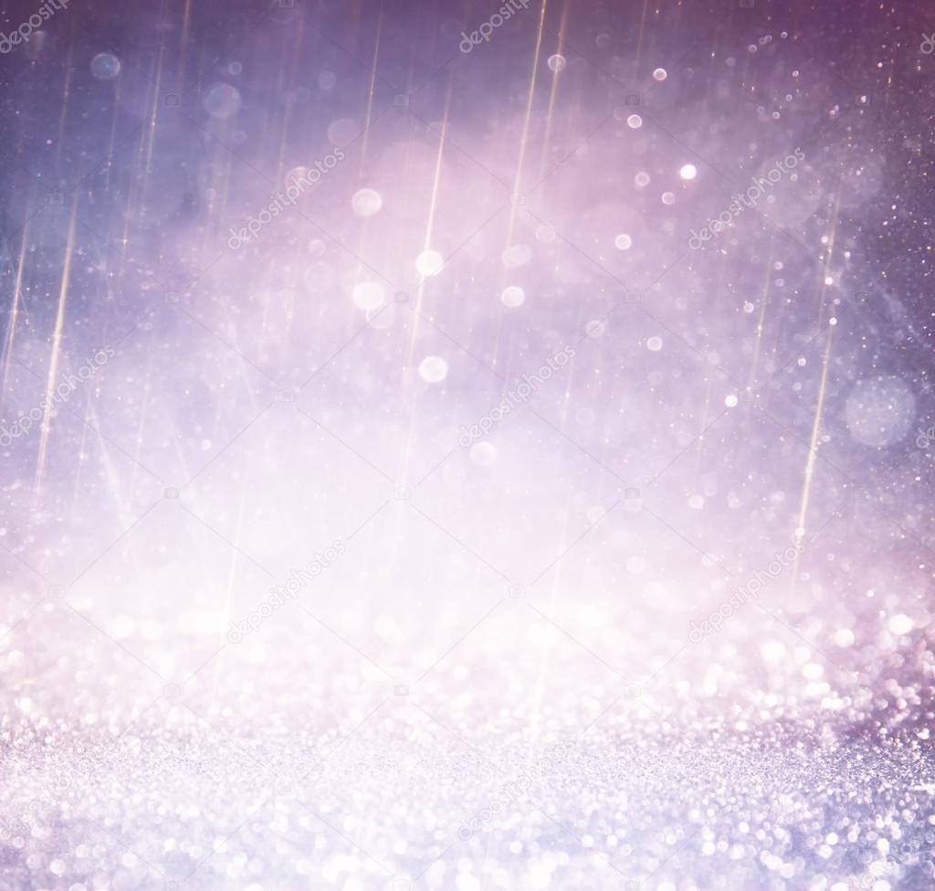 Glitter vintage lights background. light silver , gold, purple and ...