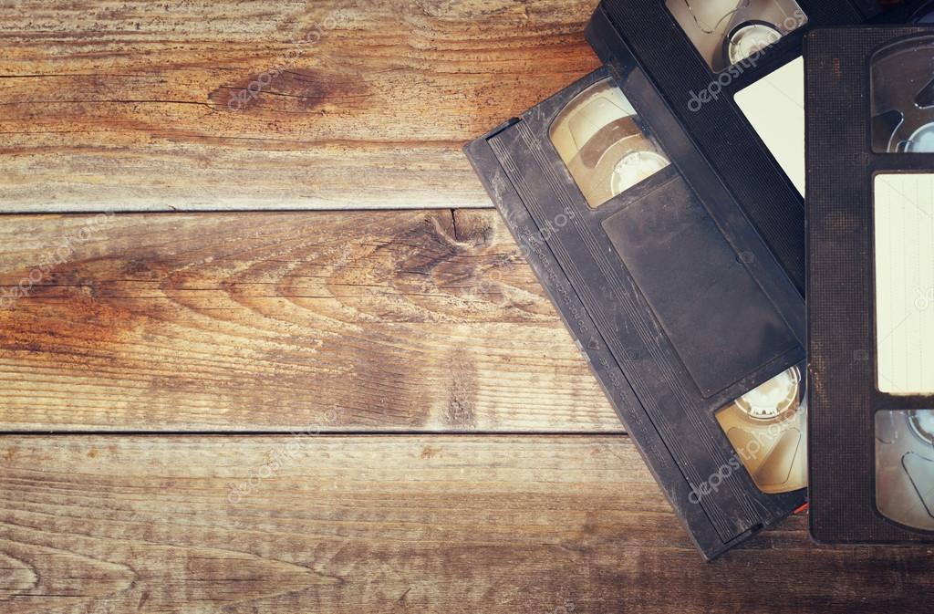 Stack of VHS video tape cassette over wooden background. top view photo ...