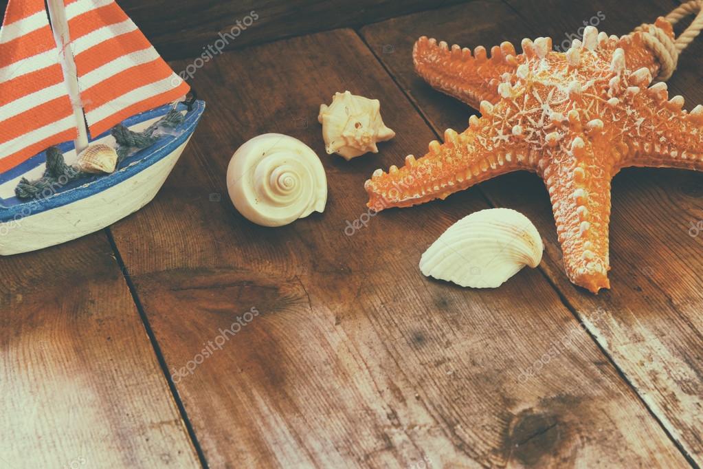 Decorative boat, sea shells and starfish — Stock Photo © tomert #86280002