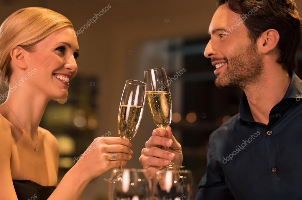 Loving couple toasting Stock Photo by ©ridofranz 101954292