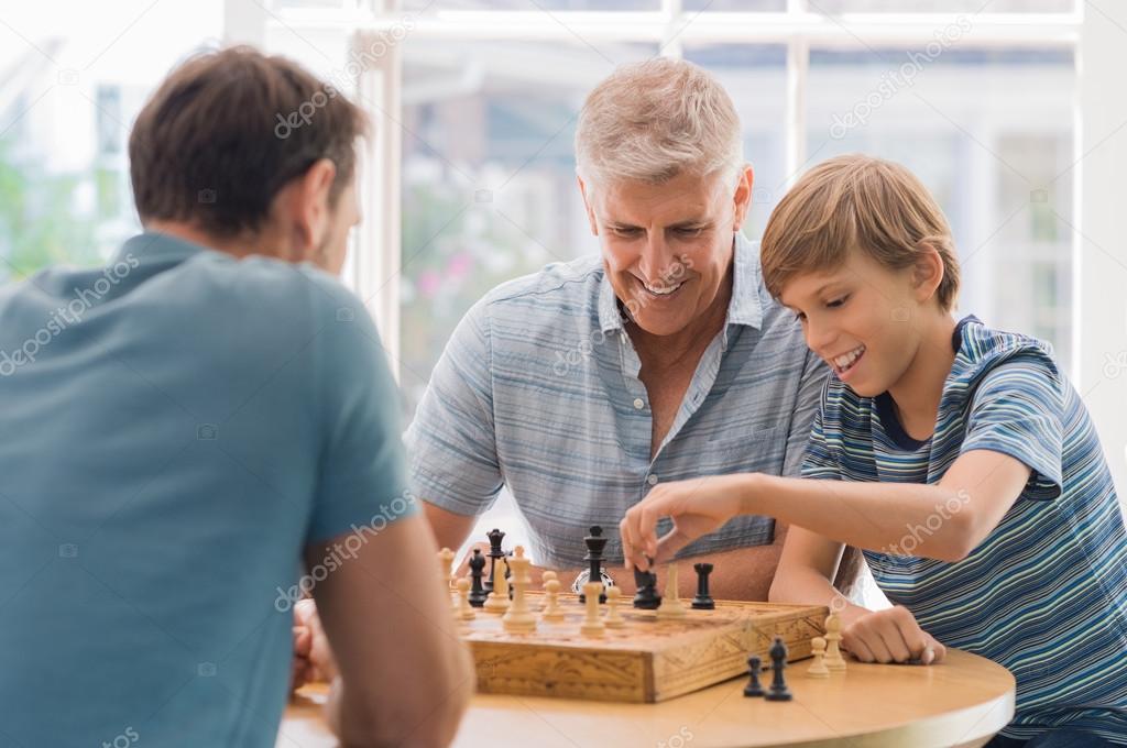 Family playing chess Stock Photo by ©ridofranz 108995890