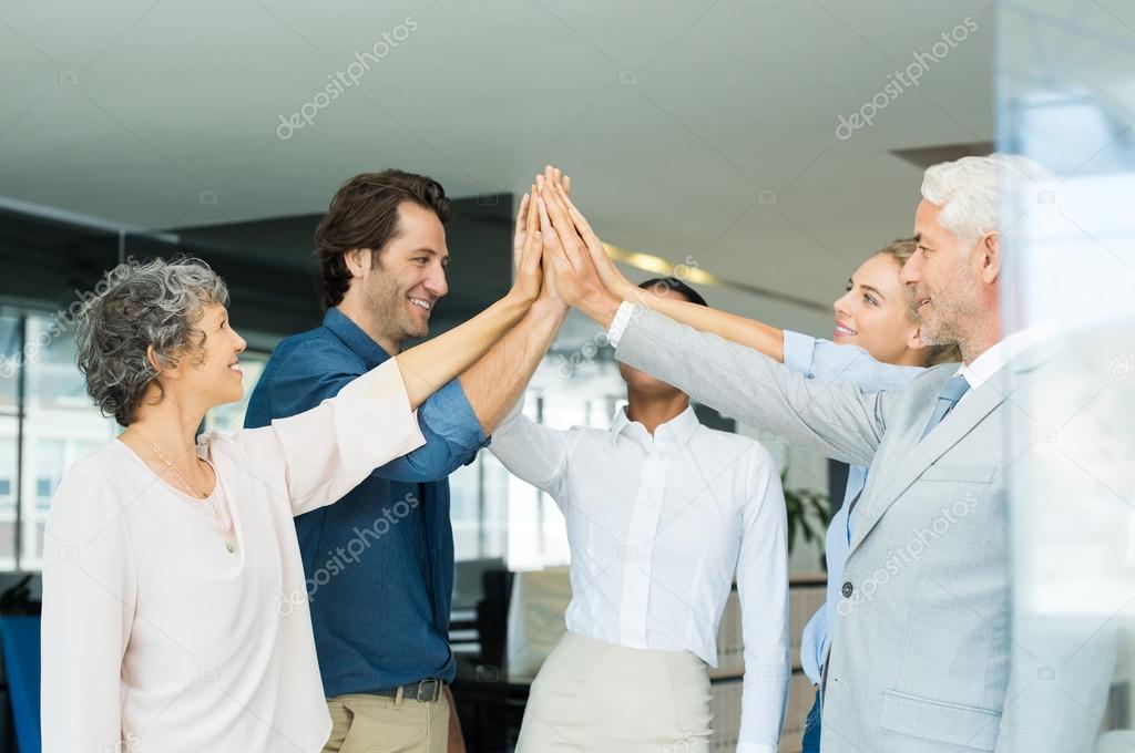 Business people giving high five Stock Photo by ©ridofranz 113131072