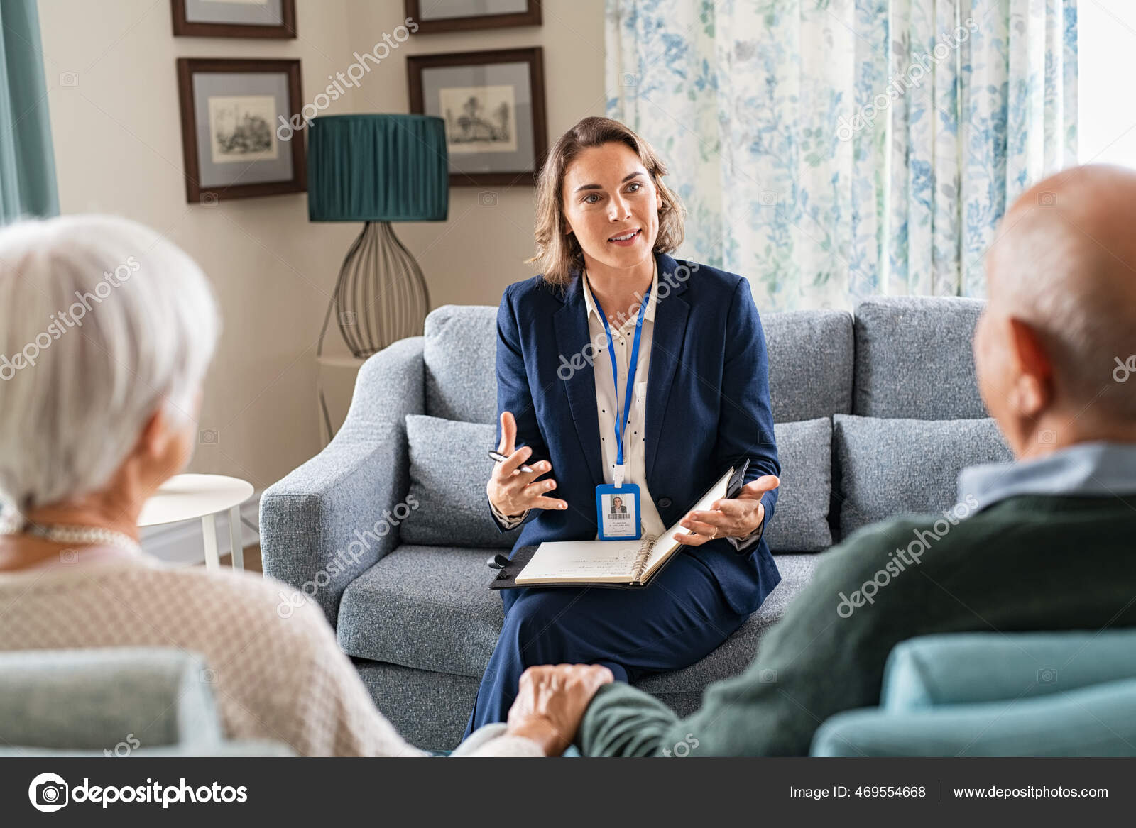 Mid Adult Support Worker Explaining Medical Details Senior Couple Home ...