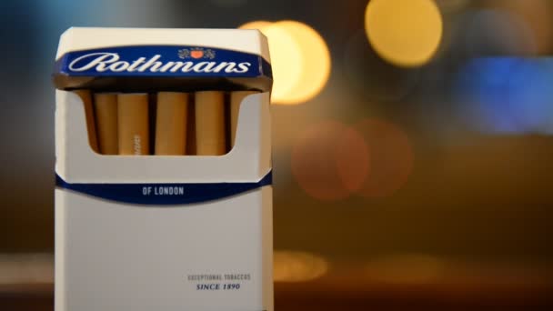 Man pulls Rothmans cigarettes — Stock Video © e_mike #65205521