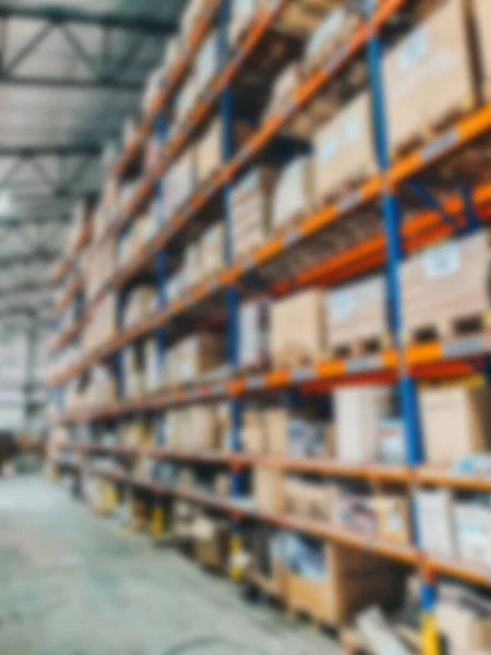 Blur factory warehouse storage with packaging box inventory for ...