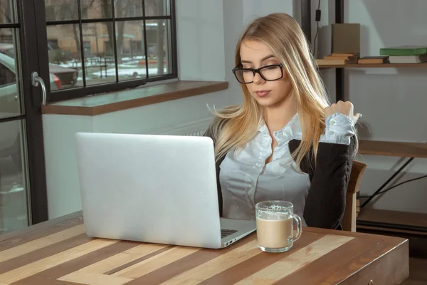 Square photo of sexy secretary working laptop in an office — Stock Photo © ponomarencko #93659594