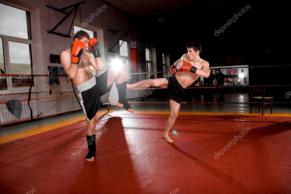 Two men is boxing on the ring — Stock Photo © ponomarencko #117379700