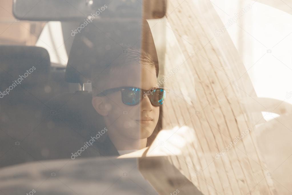 Boy driving a car Stock Photo by ©ponomarencko 122960892