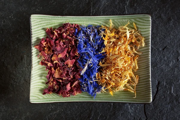 Edible flowers spice background Stock Photo by ©piolka 65815265