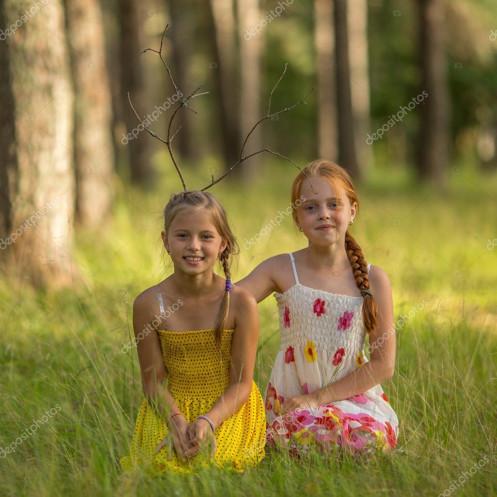 Little girls in woods. Stock Photo by ©dimaberkut 123707372