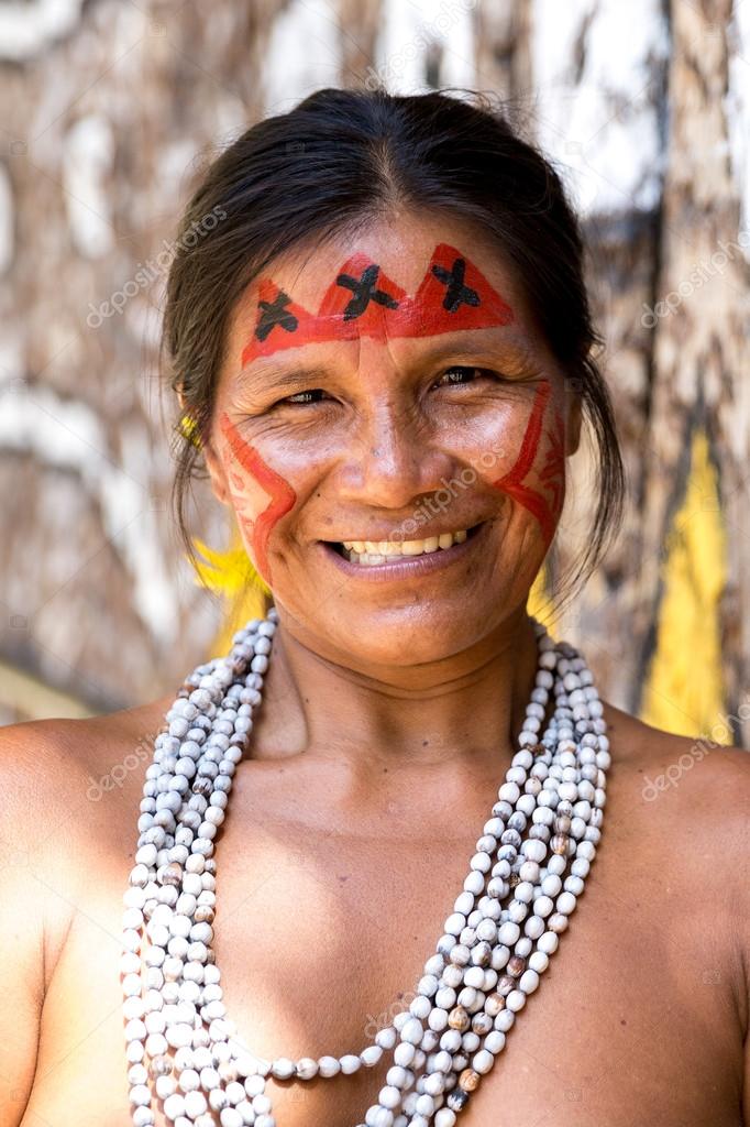 Native Brazilian woman smiling at an indigenous tribe in the Amazon ...