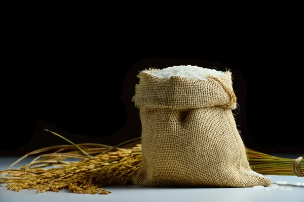 Rice in burlap sack ⬇ Stock Photo, Image by © antpkr #54739737