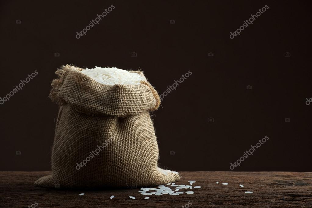 Rice in burlap sack Stock Photo by ©antpkr 54739635