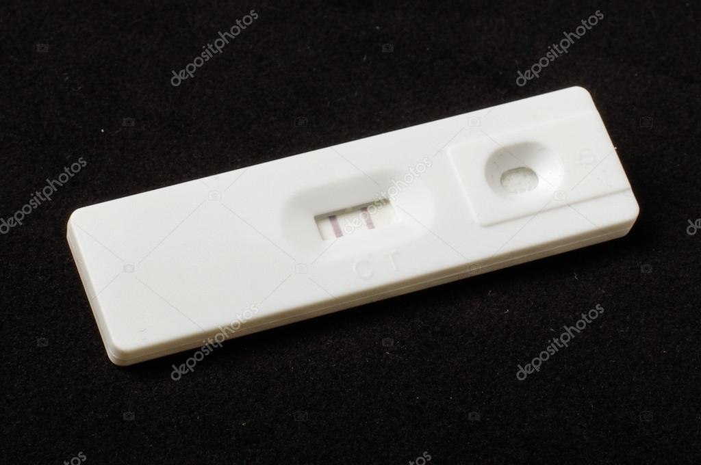 Pregnancy test on the dark background angle view Stock Photo by ...