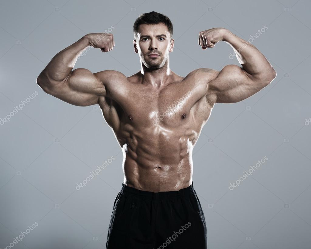 Bodybuilder posing in the studio Stock Photo by ©fotorince74 58649887