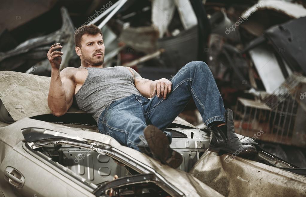 The man taking a rest on a car wreck Stock Photo by ©fotorince74 84149858