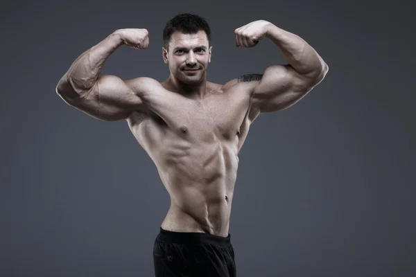 Bodybuilder posing in the studio Stock Photo by ©fotorince74 58649887