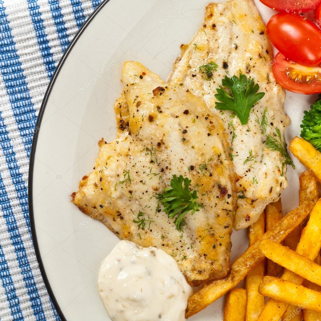 Fish dish - fried fish fillet with vegetables — Stock Photo ...
