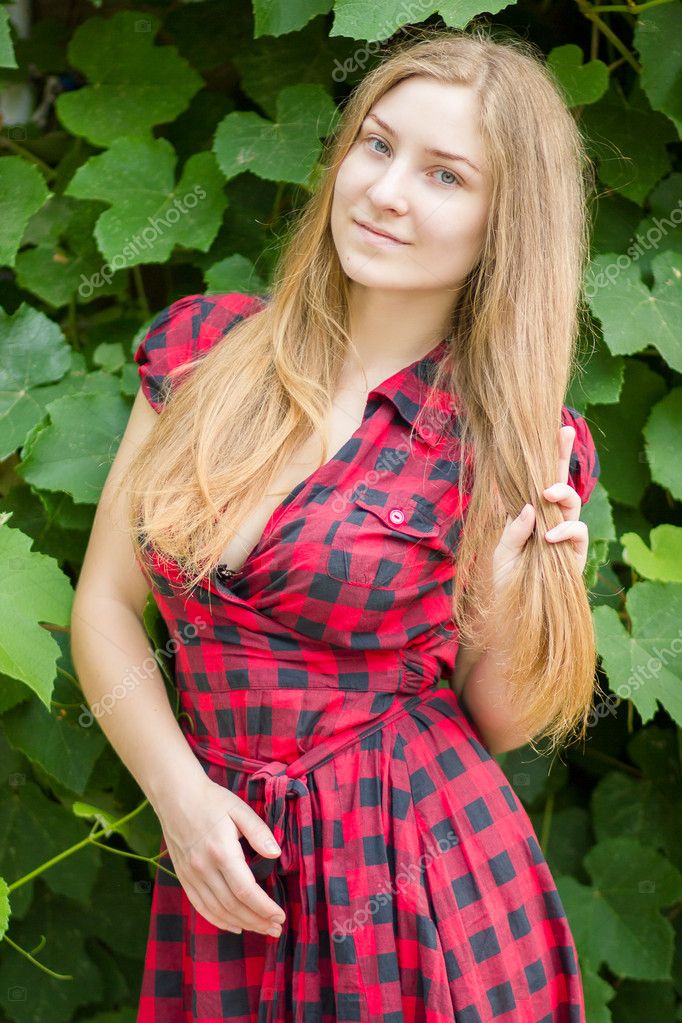 Portrait of a beautiful young woman with long brown hair Girl posing ...