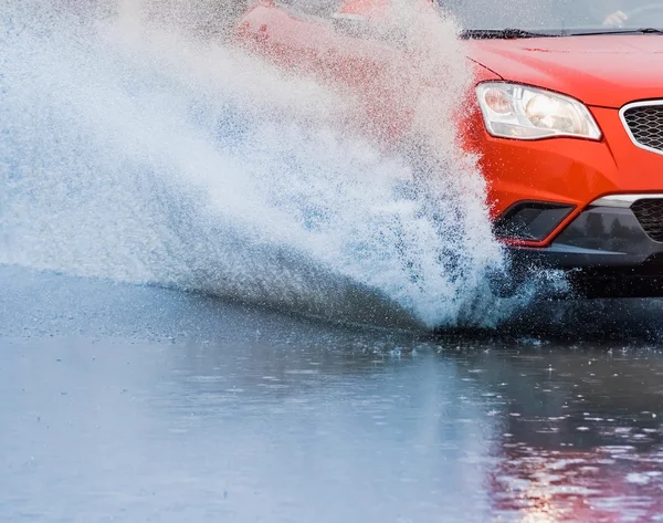 Car rain puddle splashing water - Stock Image - Everypixel
