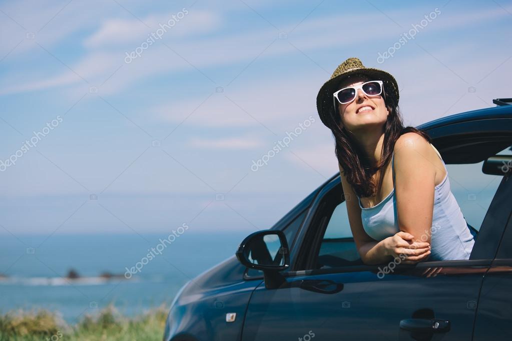Relaxed woman on summer car road trip vacation Stock Photo by ©Dirima ...