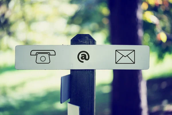 Contact signboard in an autumn park — Stock Photo © Gajus-Images #68630129