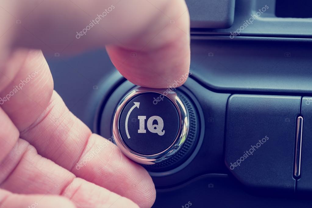 Hand of a man turning up a dial with the word IQ and an arrow — Stock ...