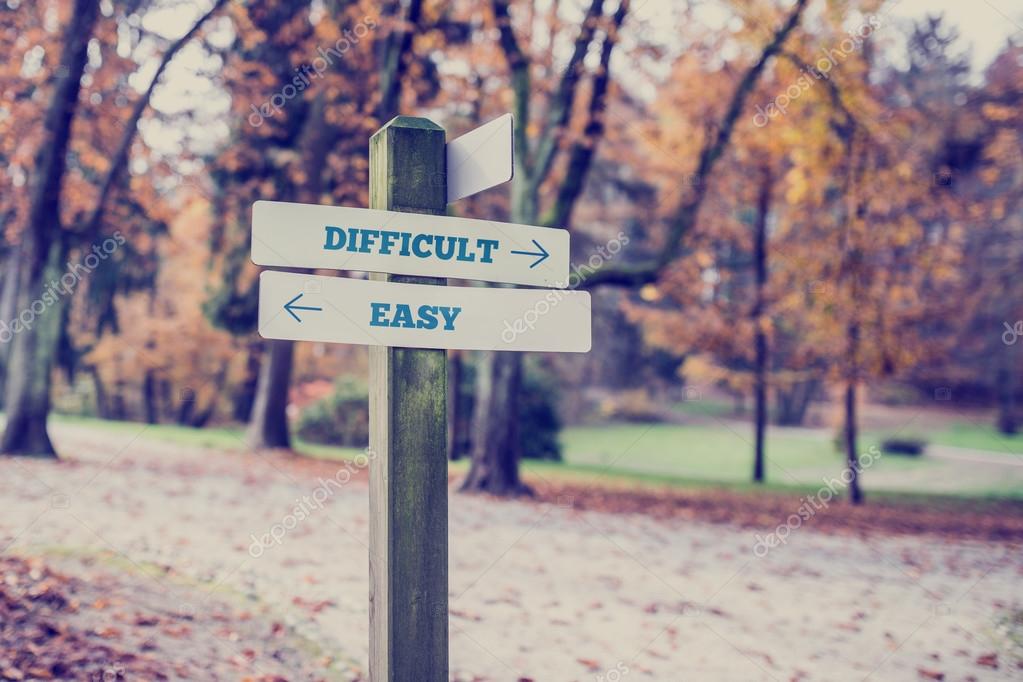 Opposite directions towards difficult and easy — Stock Photo © Gajus ...