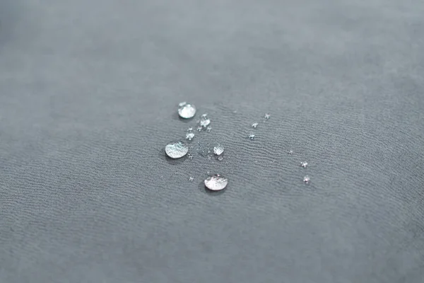 Water drops on waterproof textile material - short depth of field ...