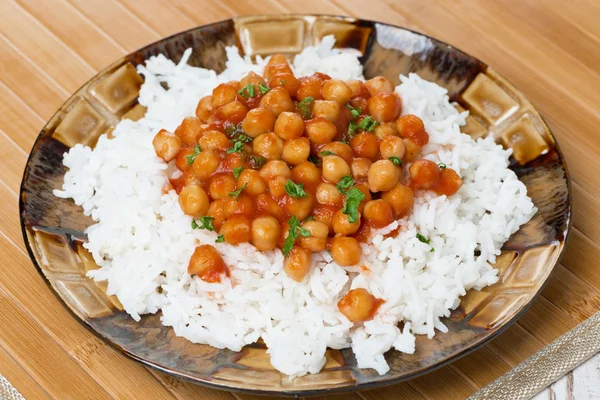 White rice with chickpeas in tomato sauce, close-up — Stock Photo ...