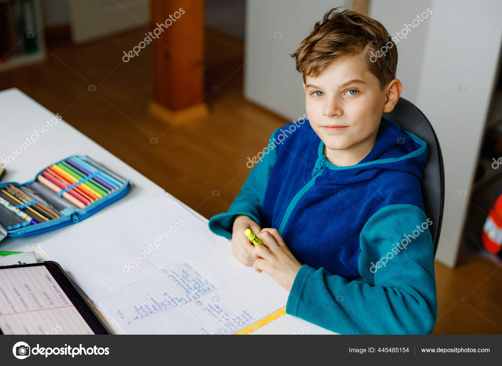 School kid boy learning at home with tablet for school. Adorable child ...