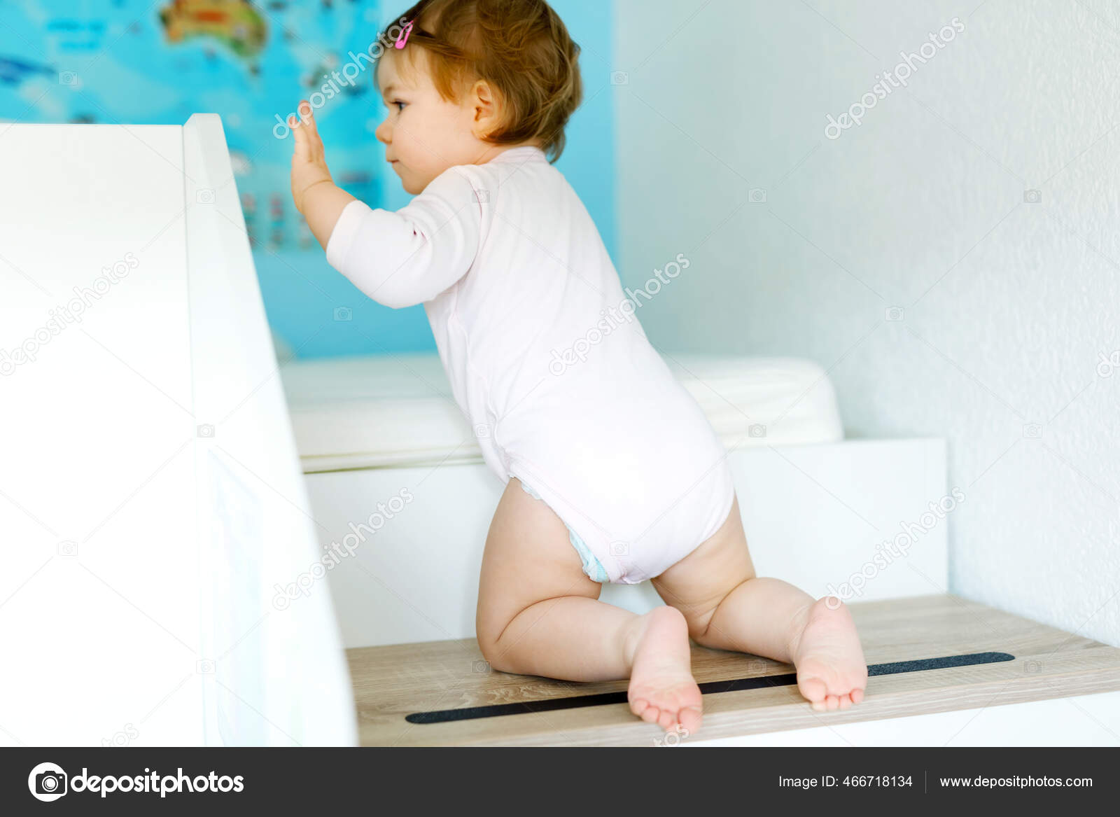 Little baby girl learning walking, standing and making first steps at ...