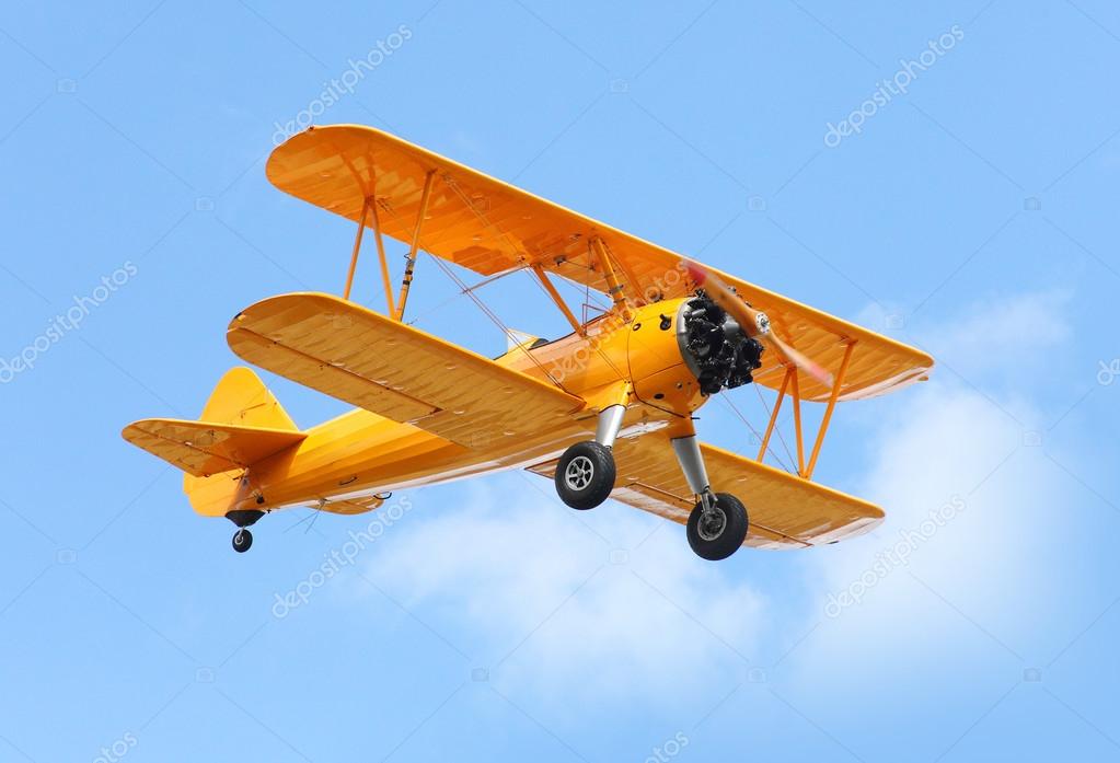 Biplane on the blue sky. Stock Photo by ©vladvitek 66007091