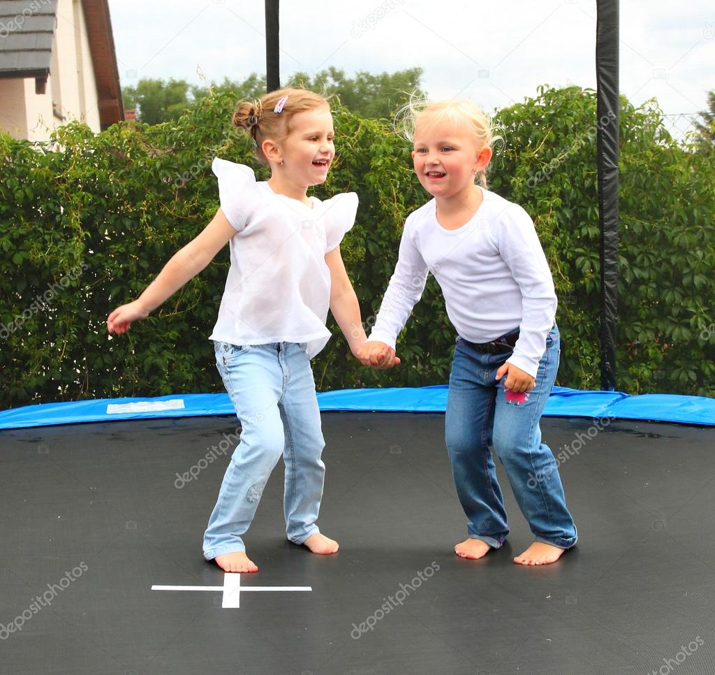 Funny kids playing and jumping — Stock Photo © vladvitek #95884302