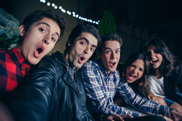 Funny friends shouting and taking selfie in party - Stock Image ...