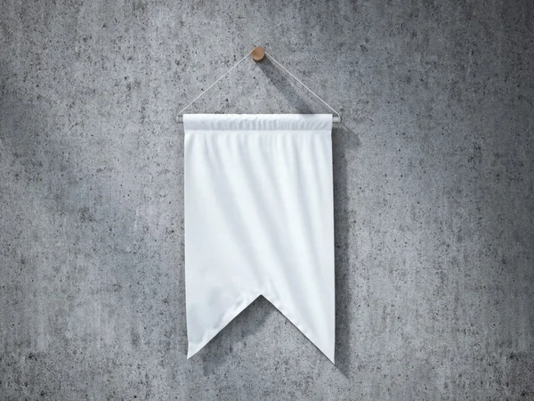 White pennant hanging on a concrete wall Stock Photo by ©ekostsov 106378578